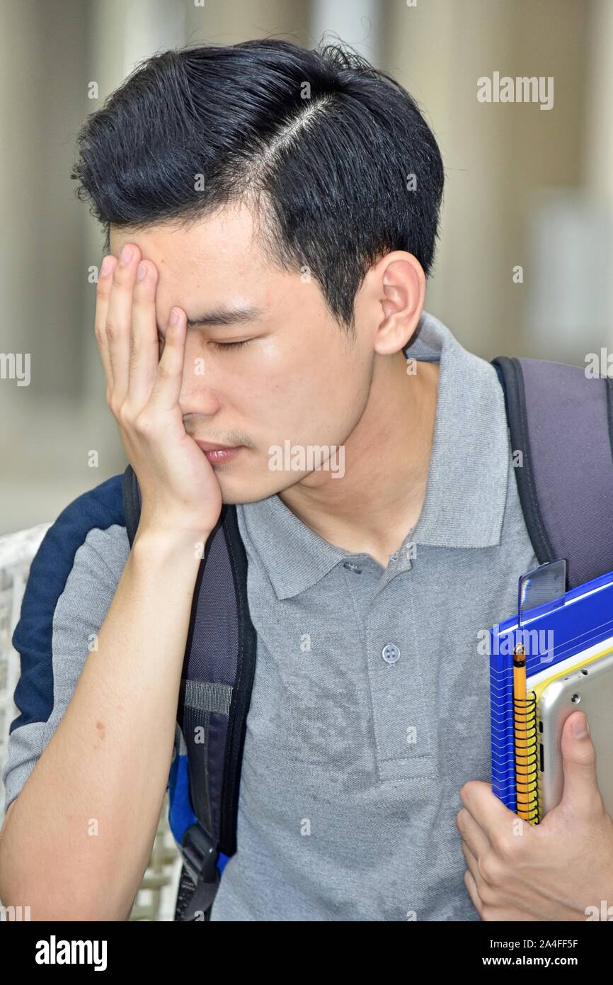 Sad Boy Student With Books Stock Photo - Alamy