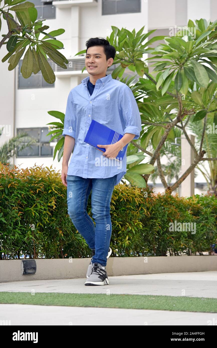 Intelligent Handsome Person With Books Walking Stock Photo - Alamy
