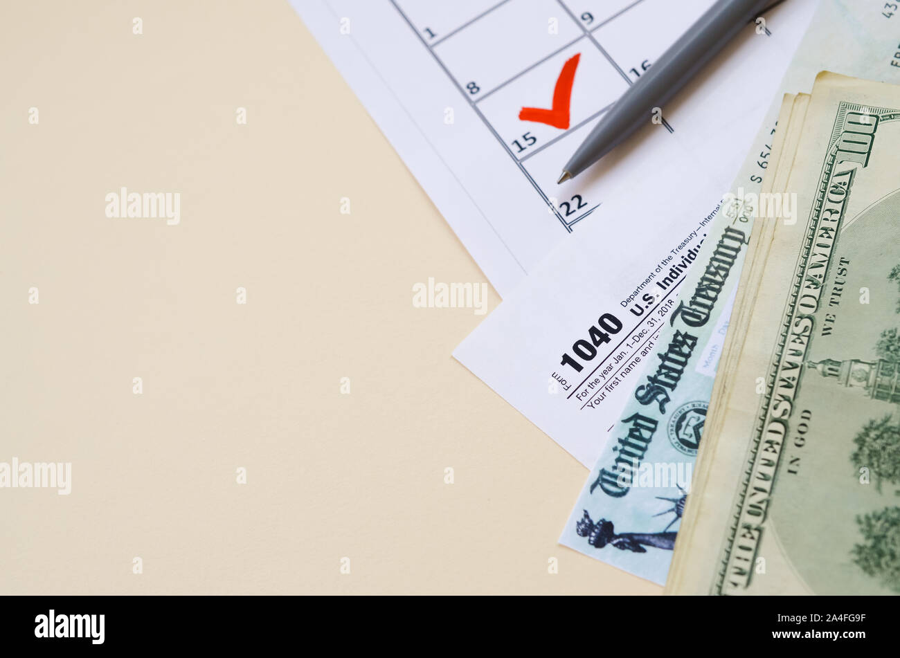 1040 Individual Income tax return form with Refund Check and hundred ...