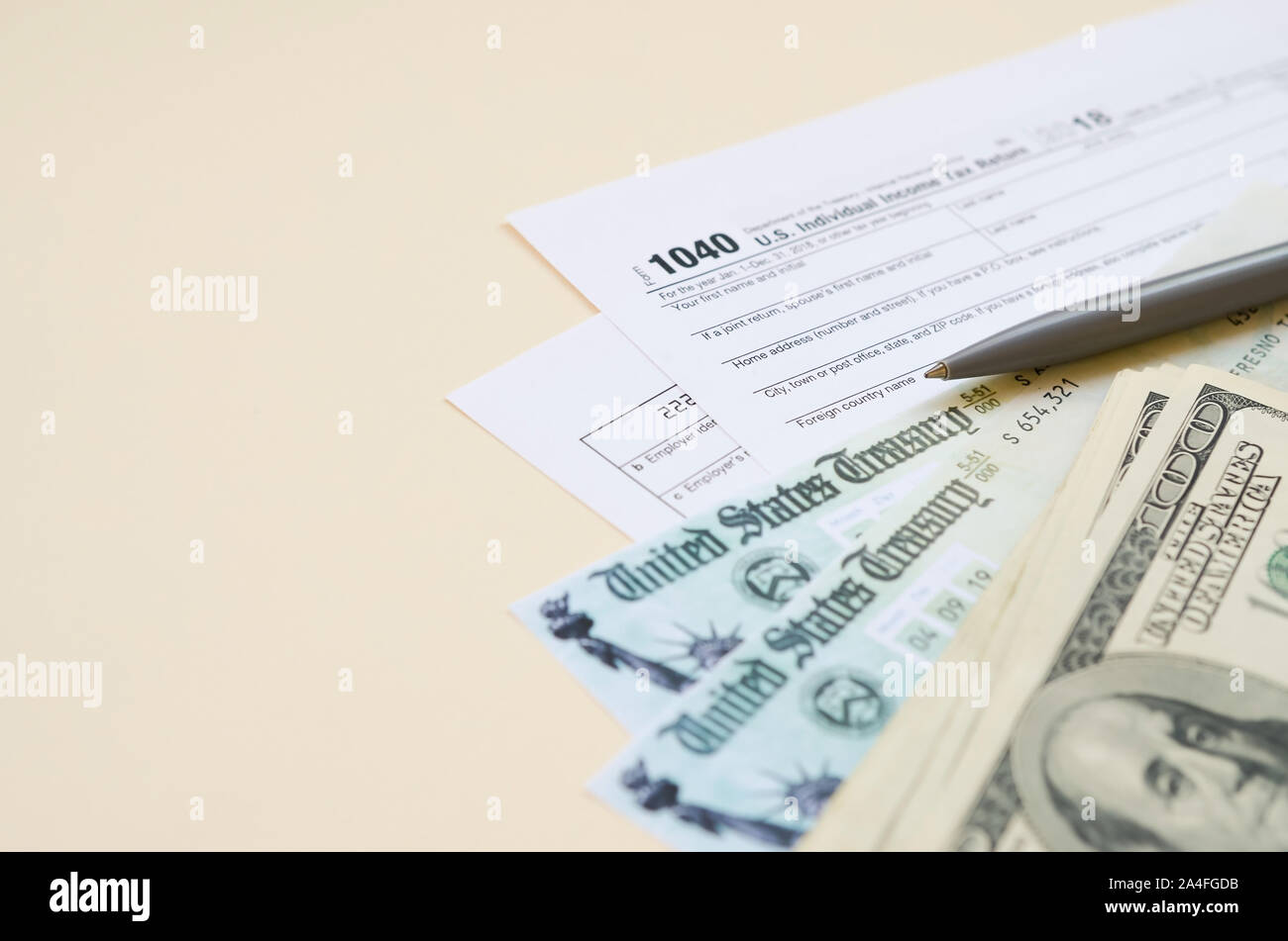 1040 Individual Income tax return form with Refund Check and hundred ...