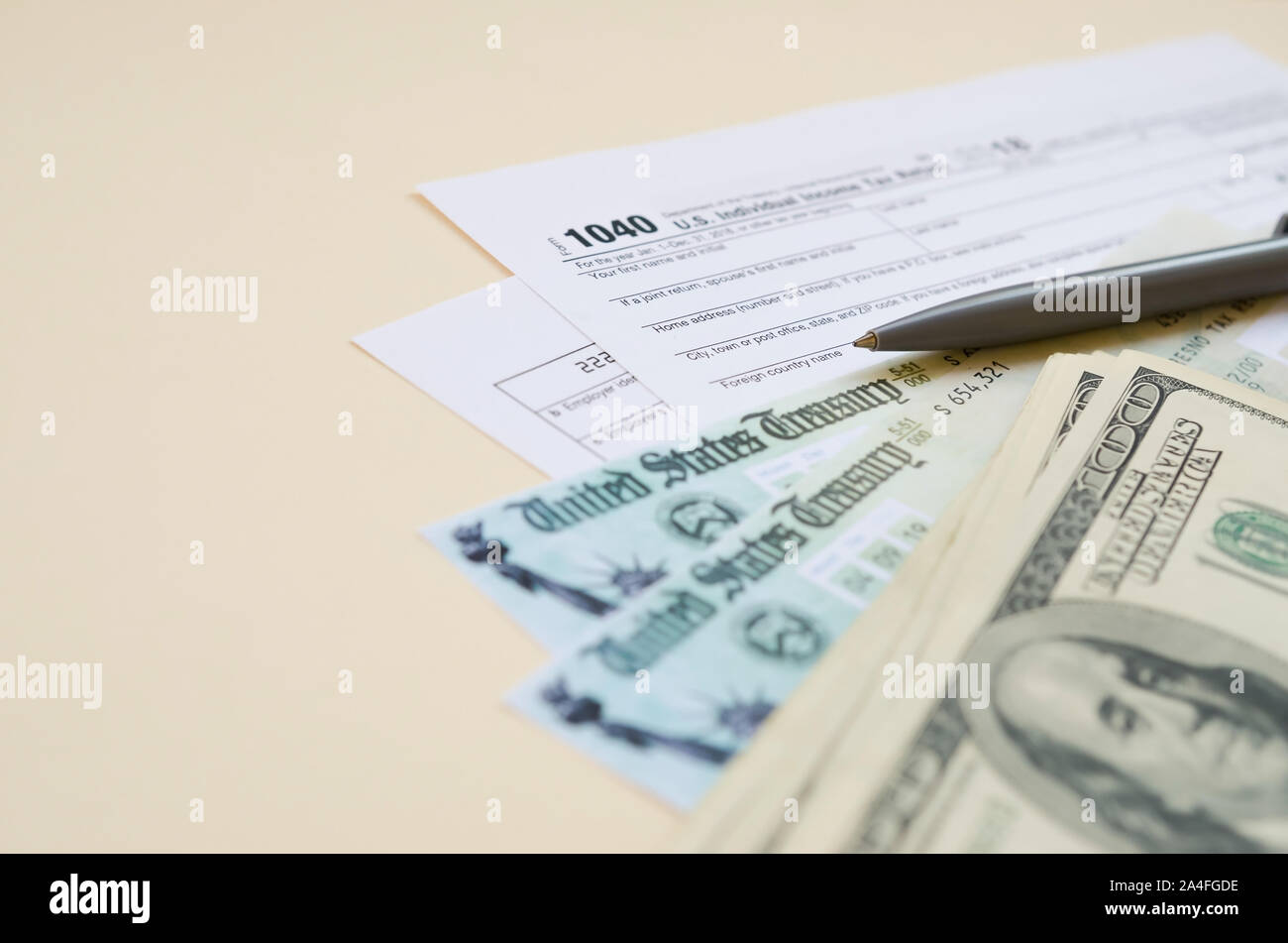 1040 Individual Income tax return form with Refund Check and hundred ...