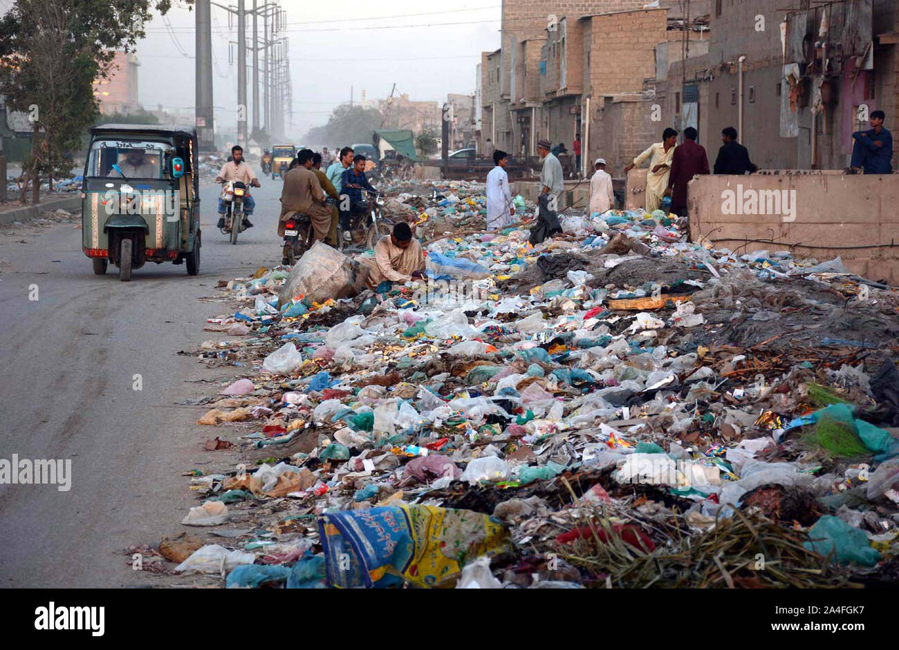 Karachi, Pakistan. 14th Oct, 2019.Heap of garbage covered sewerage ...