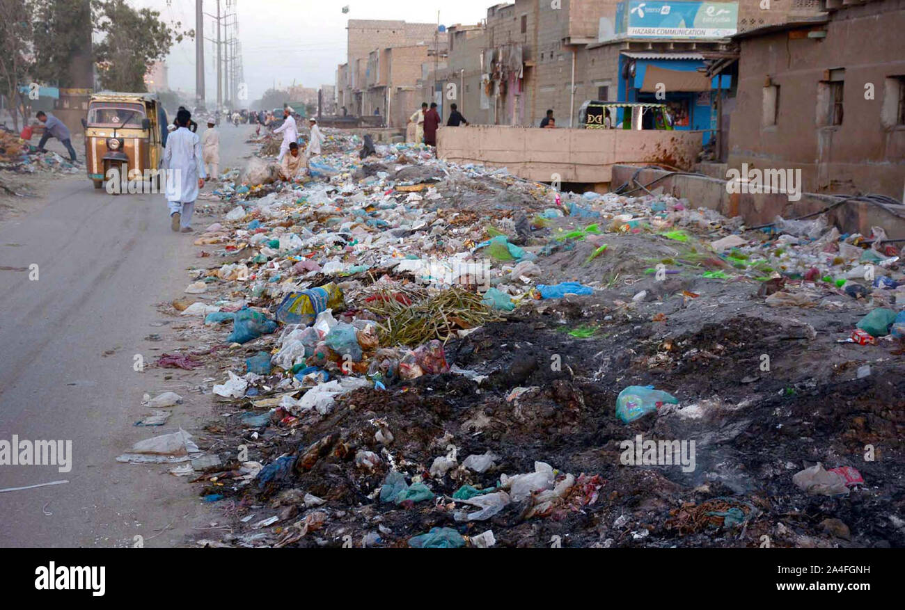 Karachi, Pakistan. 14th Oct, 2019.Heap of garbage covered sewerage ...