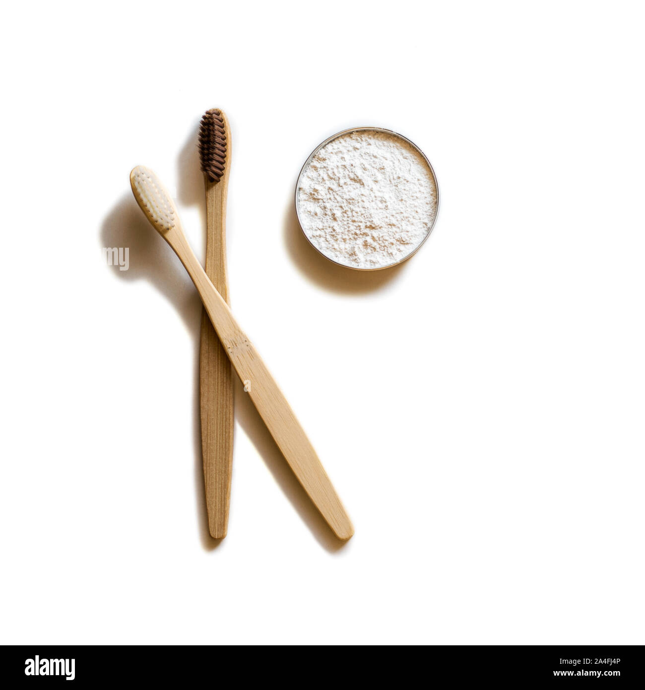 Two bamboo toothbrush with tooth powder isolated on white background ...