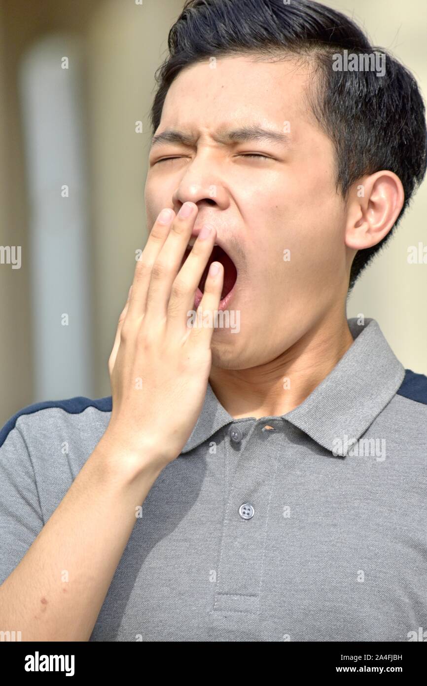 Sleepy Diverse Male Stock Photo - Alamy