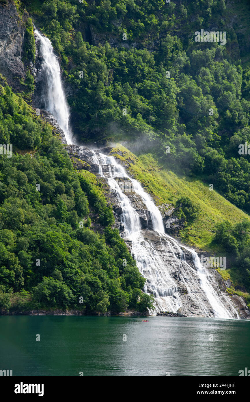 A waterfall tumbling into Geiranger Fjord, Vestlandet, Norway, Europe ...