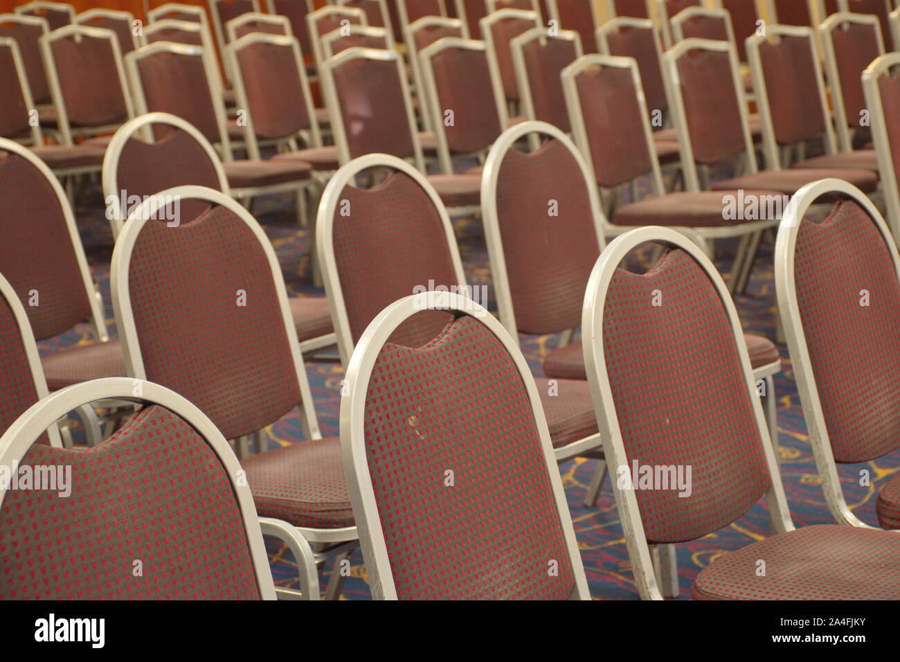 Group of brown chairs in rows Stock Photo - Alamy