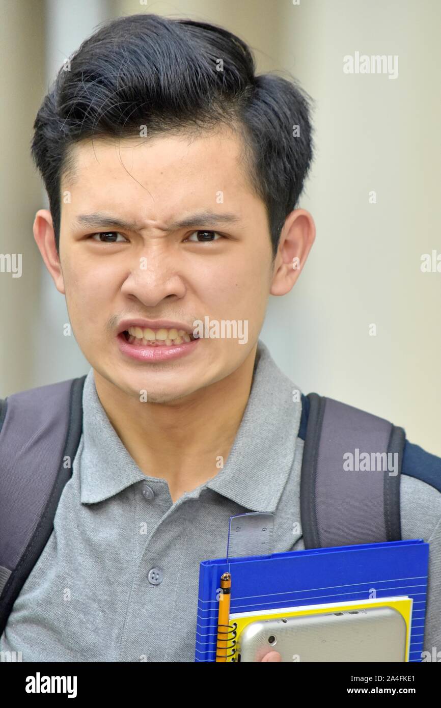 An Upset University Asian Student Stock Photo - Alamy