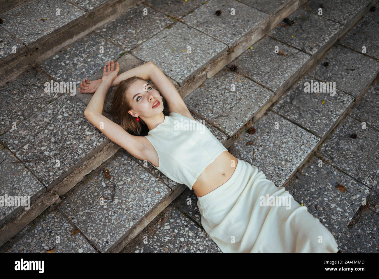 Lying down stairs blonde hi-res stock photography and images - Alamy