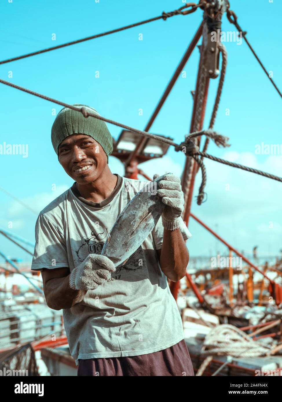 Portrait of fisherman with fish Stock Photo - Alamy