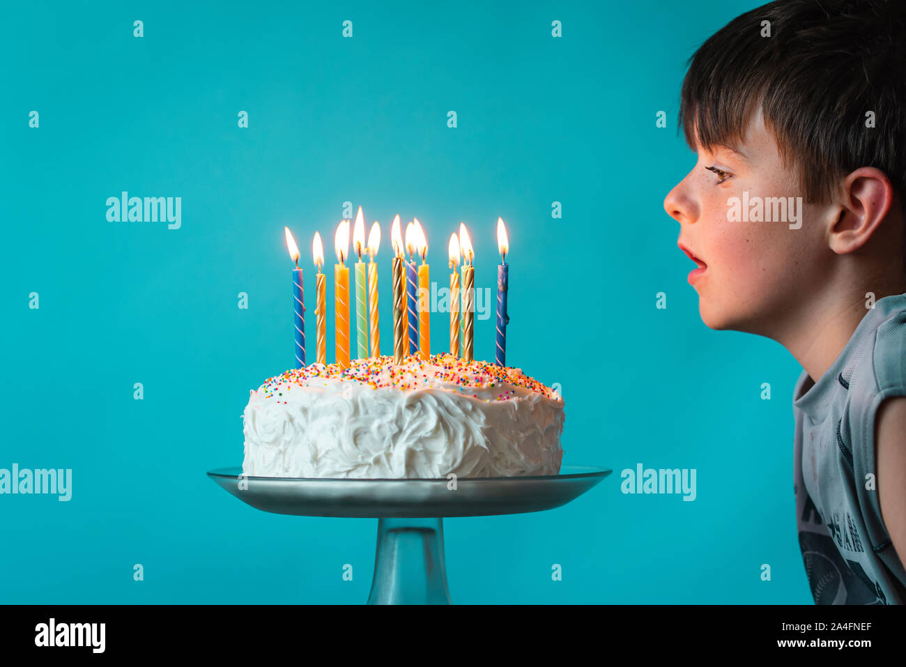 Happy birthday cake candles blow hi-res stock photography and images ...