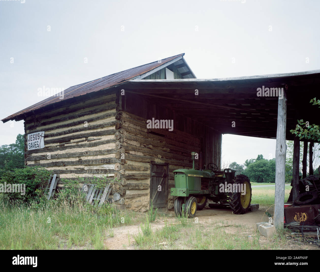 Tractor under a shed lean-to in rural North Carolina Stock Photo - Alamy