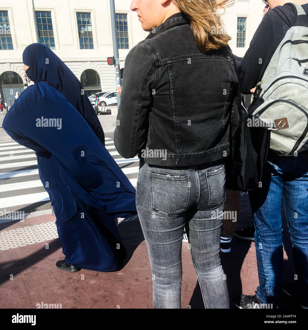 Muslim woman wearing complete chador stands in a street of Lyon, France ...