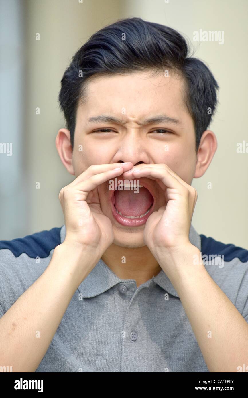 Young Asian Male Shouting Stock Photo - Alamy