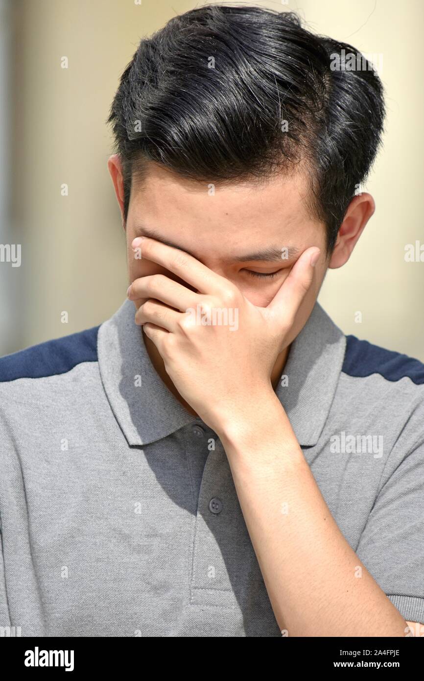 An Unhappy Filipino Male Stock Photo - Alamy