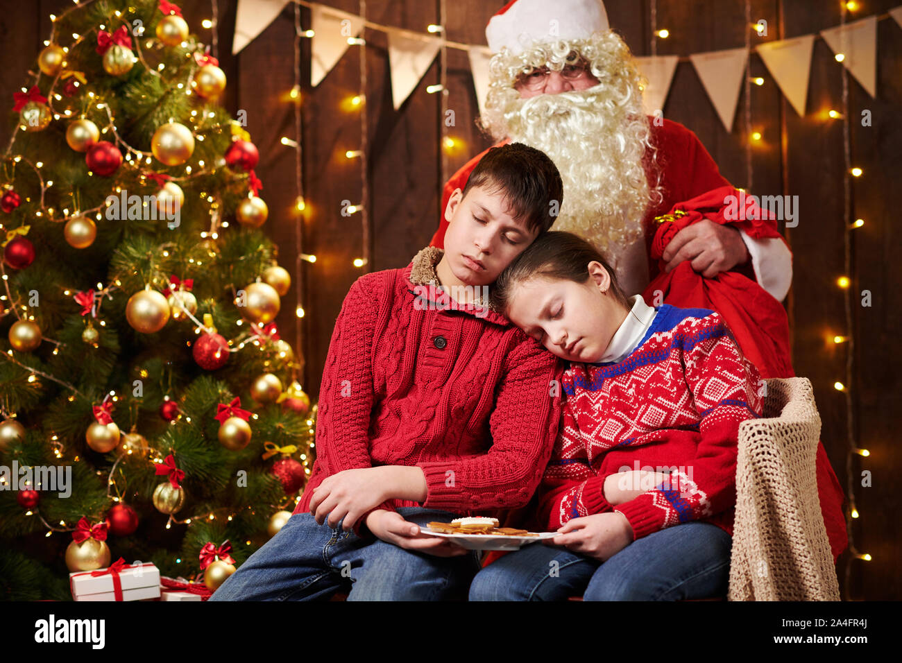The children waited a long time for Santa, now they fell asleep and ...