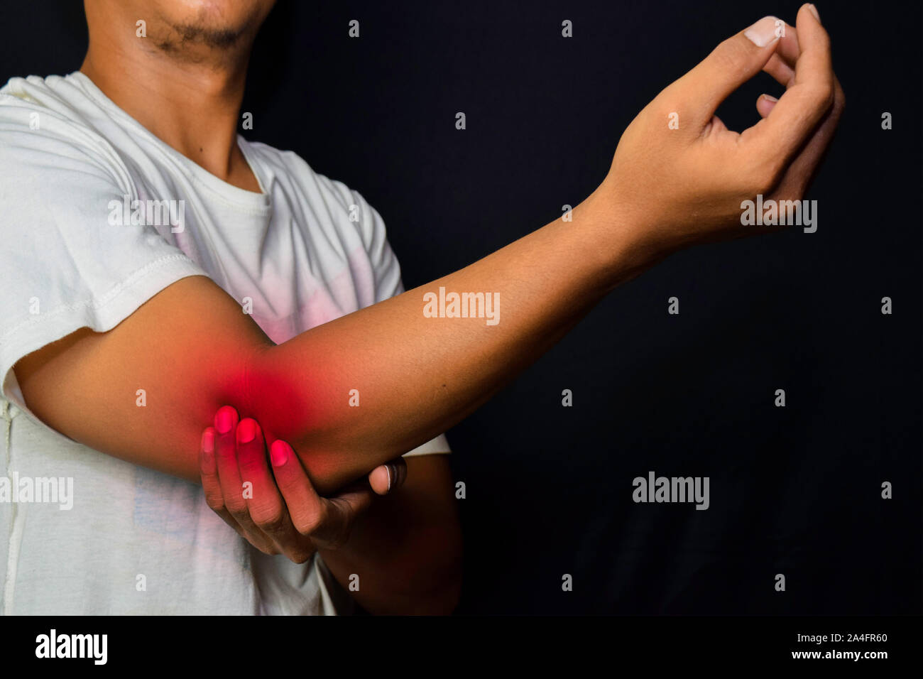 Asian Man Holding his hand. He feels pain on his elbow with black ...