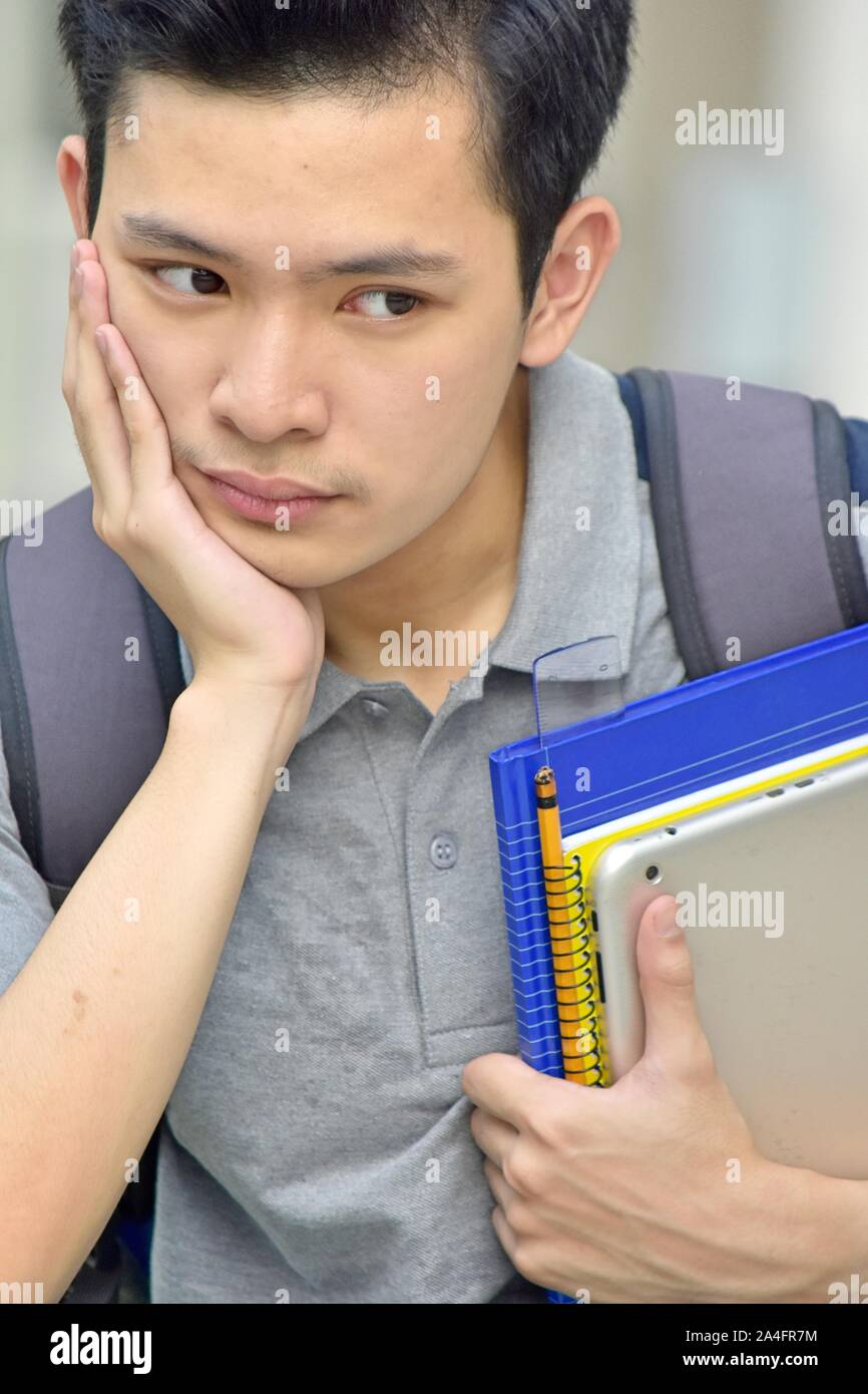 Handsome Filipino Boy Student Alone With Books Stock Photo - Alamy