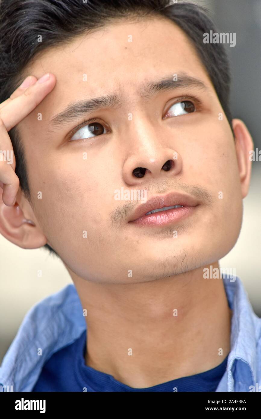 Thoughtful Filipino Teenage Male Stock Photo - Alamy