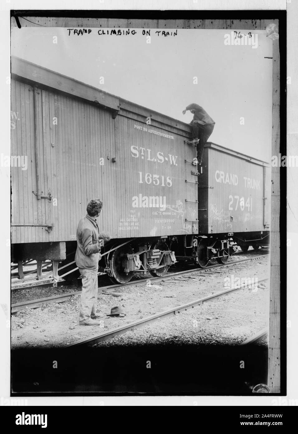 Tramp climbing on railroad car Stock Photo - Alamy