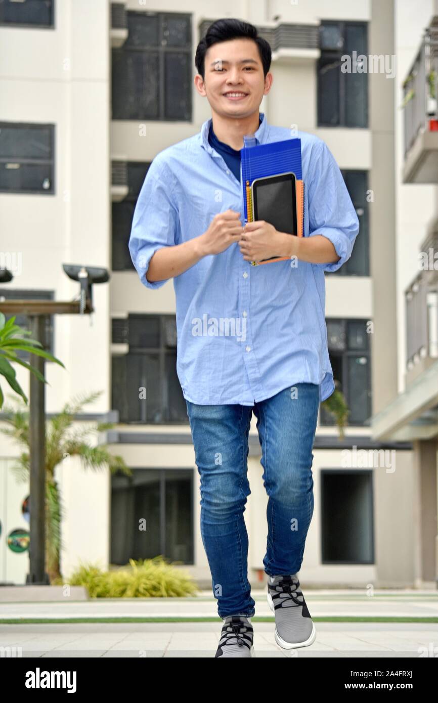 Male Student And Happiness Walking On Campus Stock Photo - Alamy