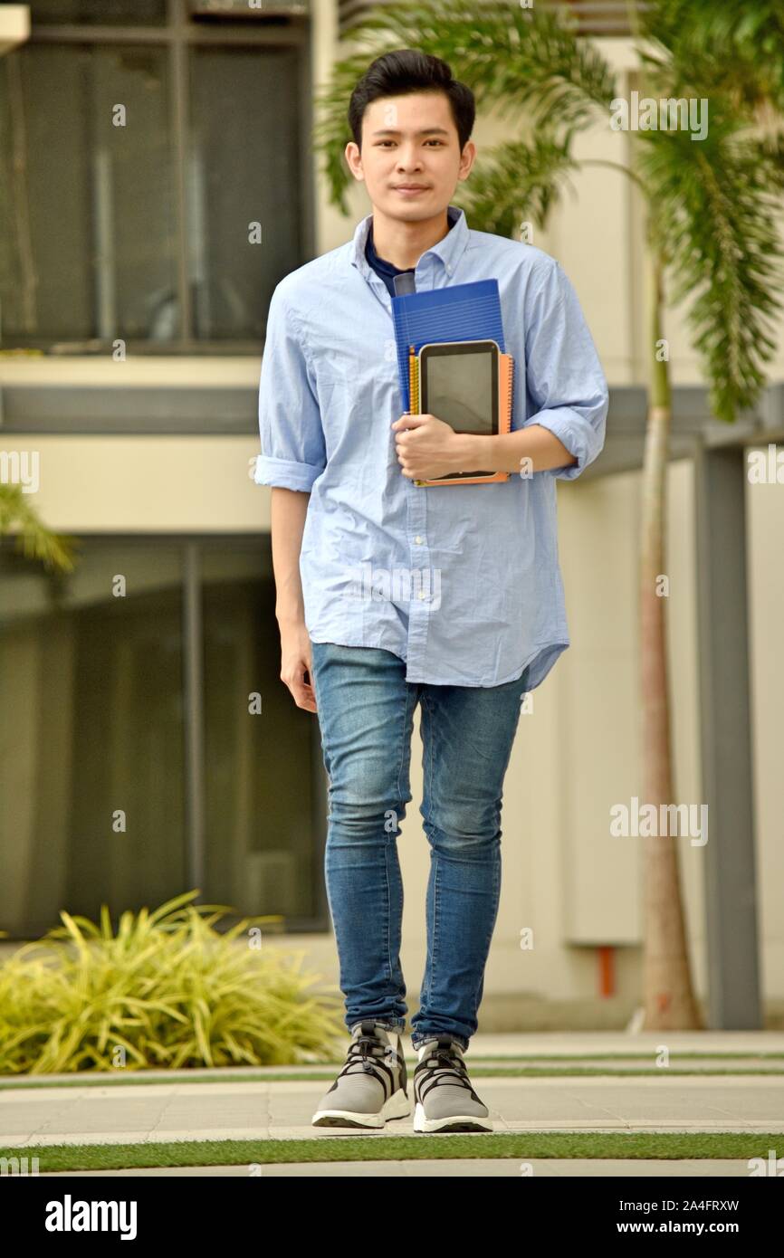 Smart University Asian Boy Student With Books Walking On Campus Stock ...
