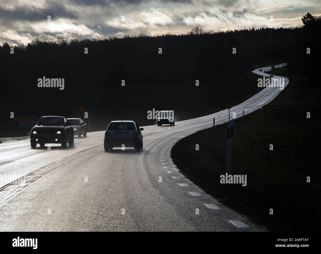 Cars on road in backlight.Photo Jeppe Gustafsson Stock Photo - Alamy