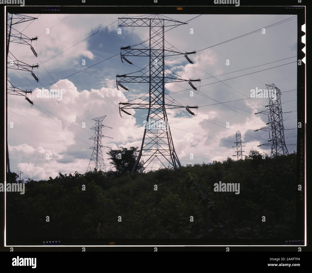 Transmission line towers and high tension lines that carry current ...