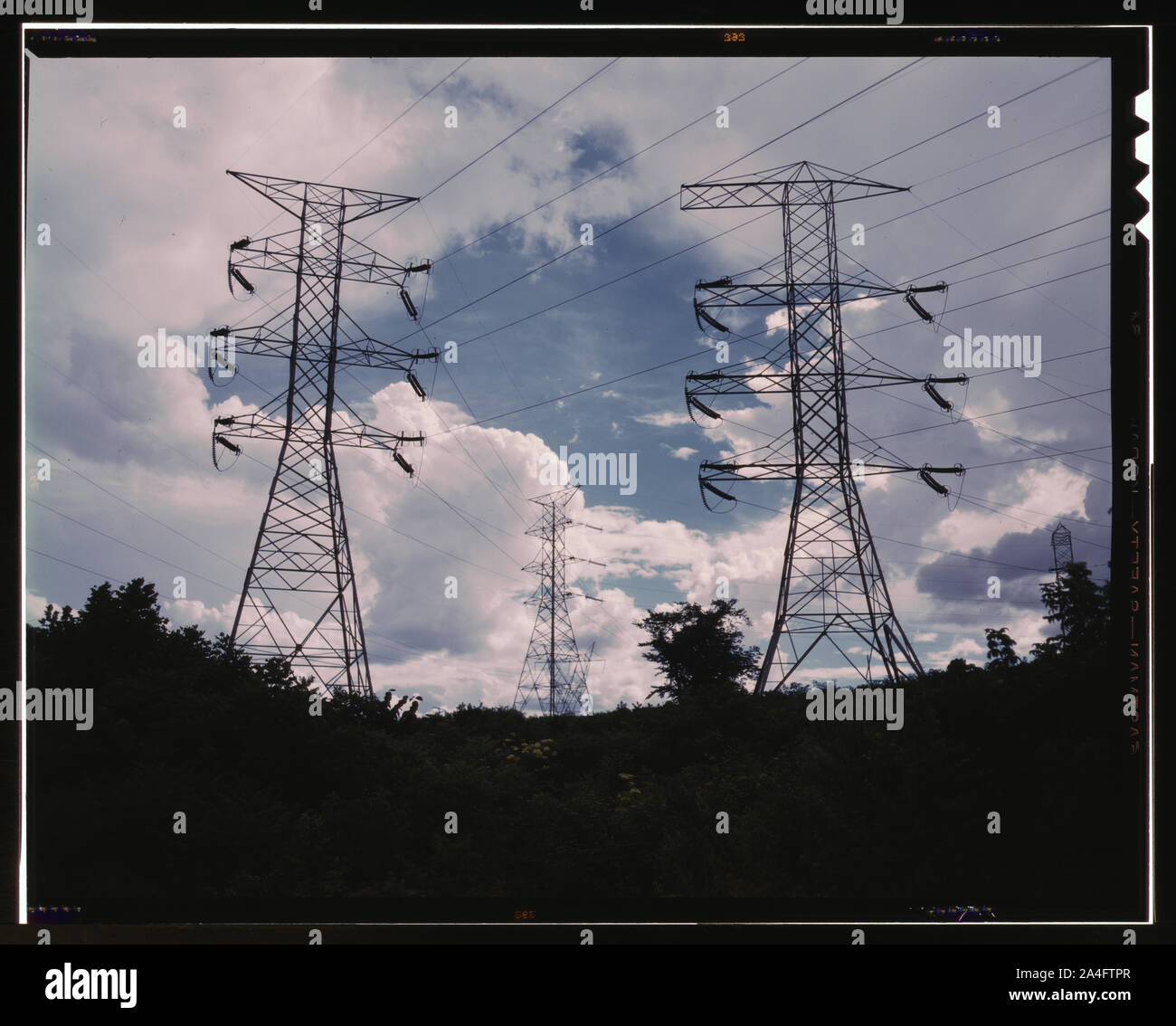Transmission line towers and high tension lines that carry current ...