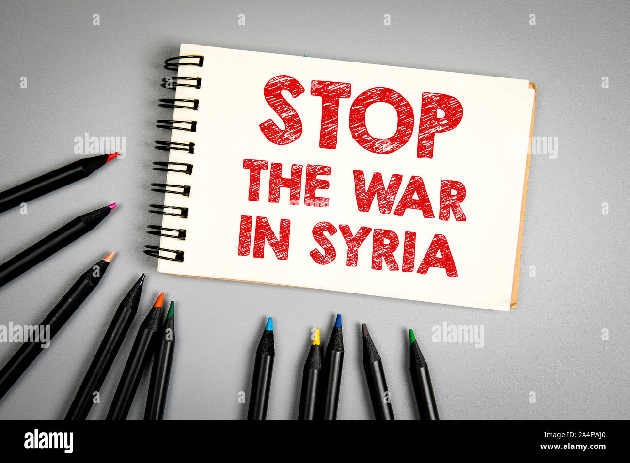 Stop the war in Syria. Handwriting text in the notebook Stock Photo - Alamy