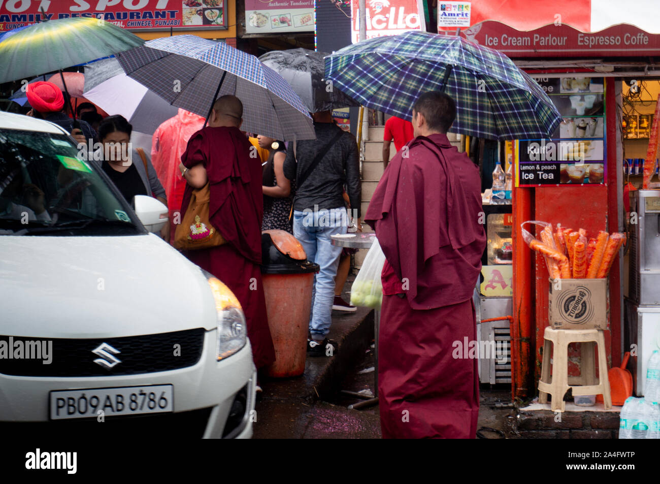 Old monk walking on street hi-res stock photography and images - Alamy