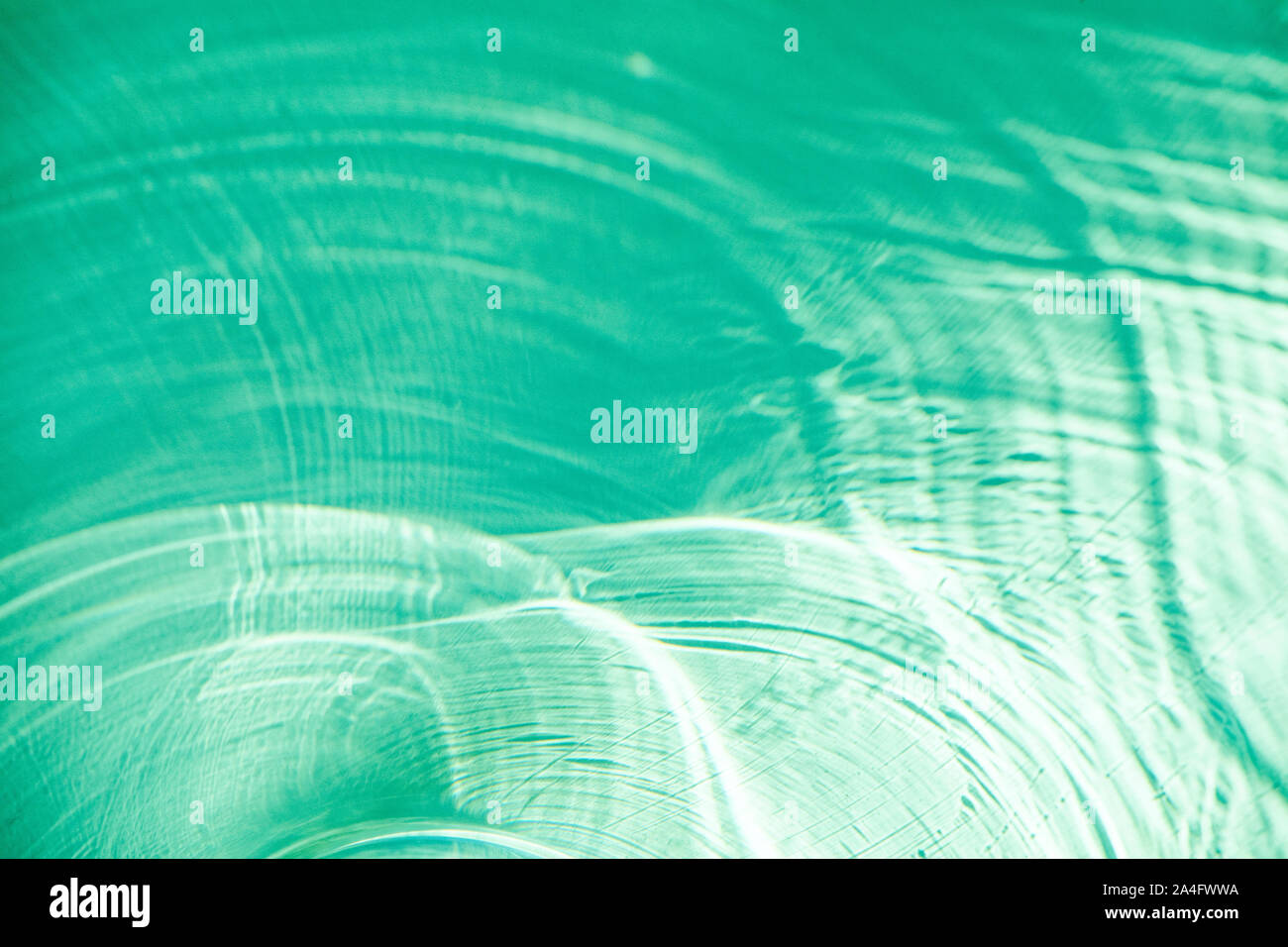 Trendy mint colored abstract background with light and shadows caustic ...