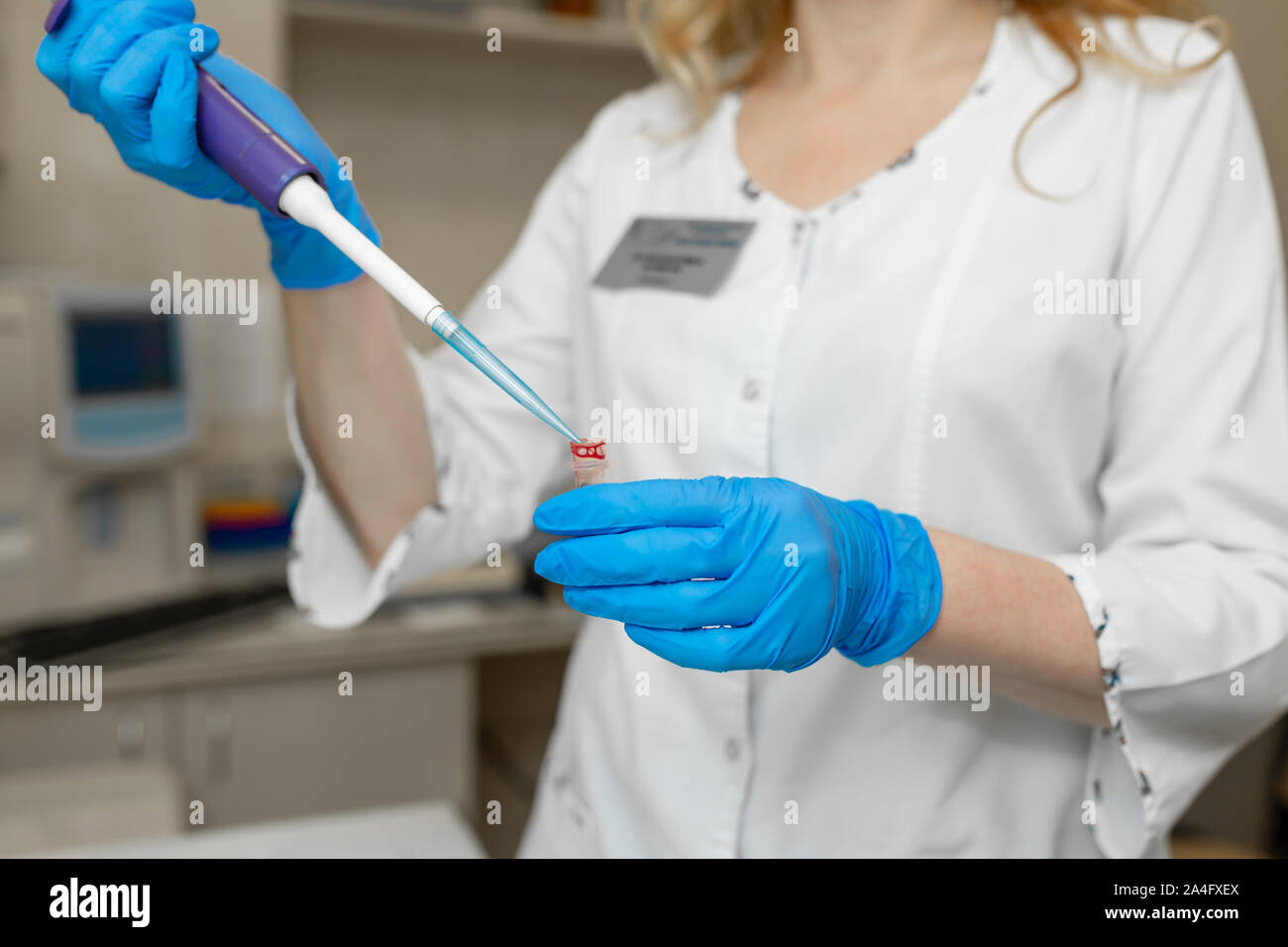 Woman lab technician take blood sample from test tube Stock Photo - Alamy
