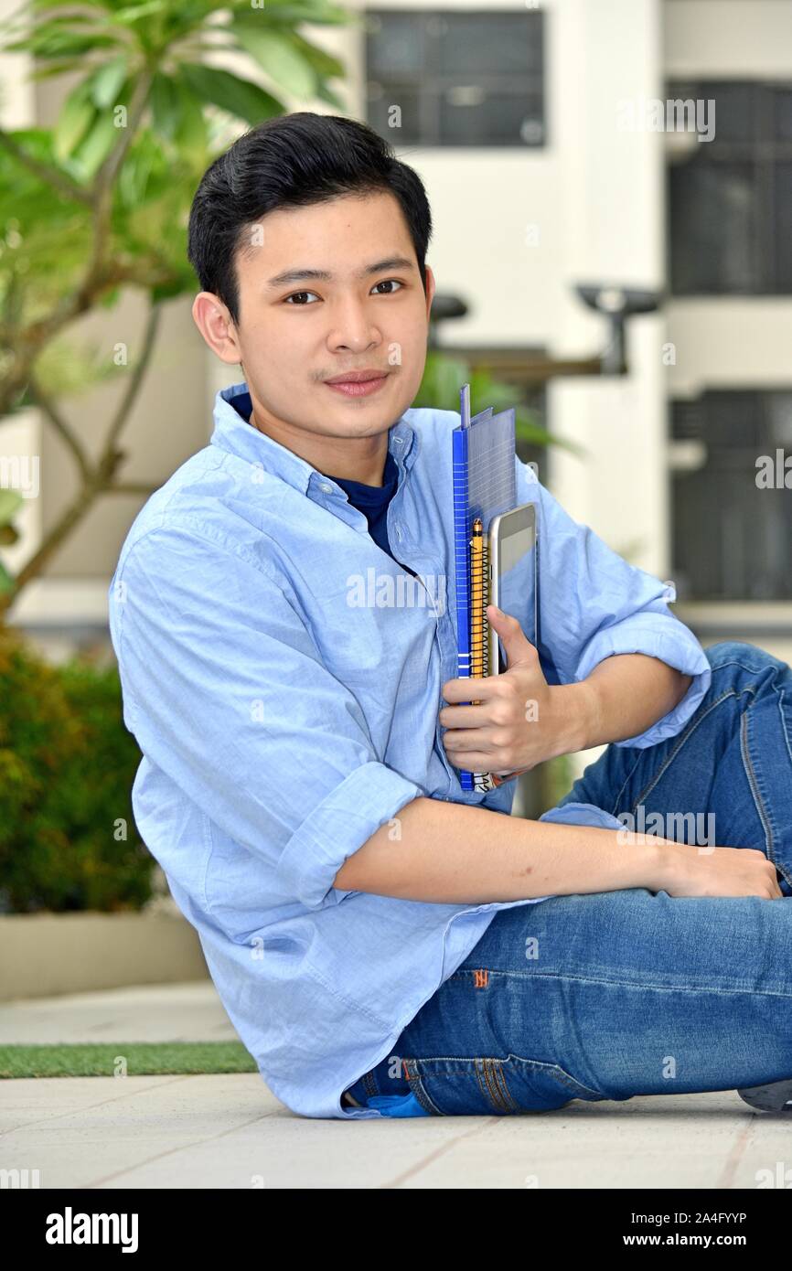 Smart Male Student Sitting Stock Photo - Alamy