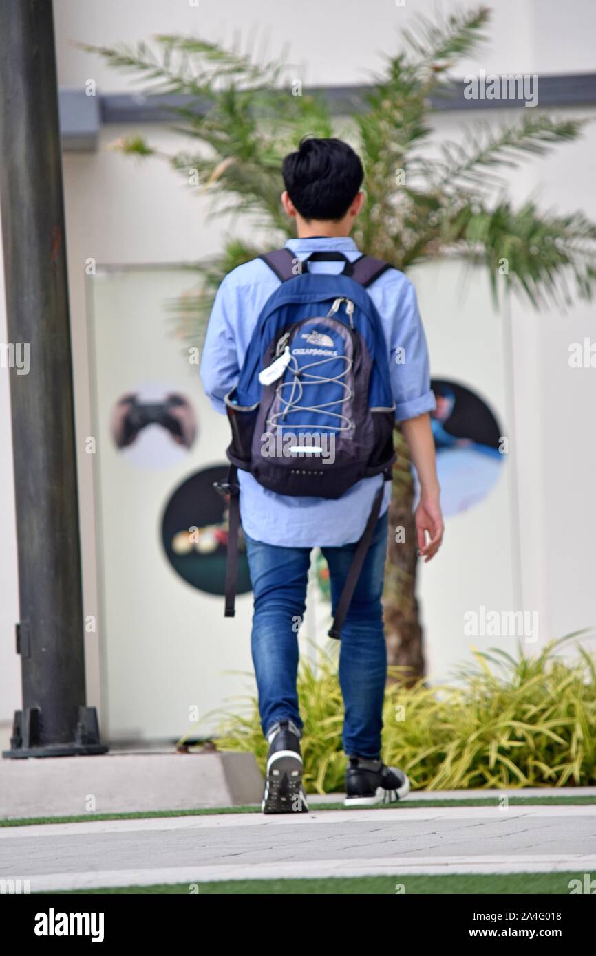 Male Student Wearing Backpack On Campus Stock Photo - Alamy