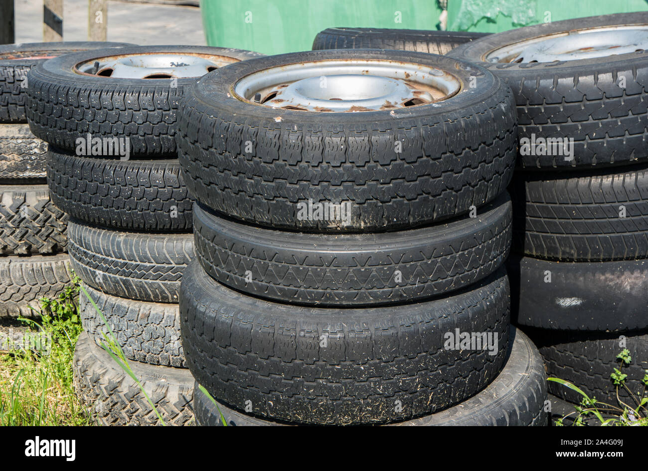 Industrial waste tyre disposal background Stock Photo - Alamy