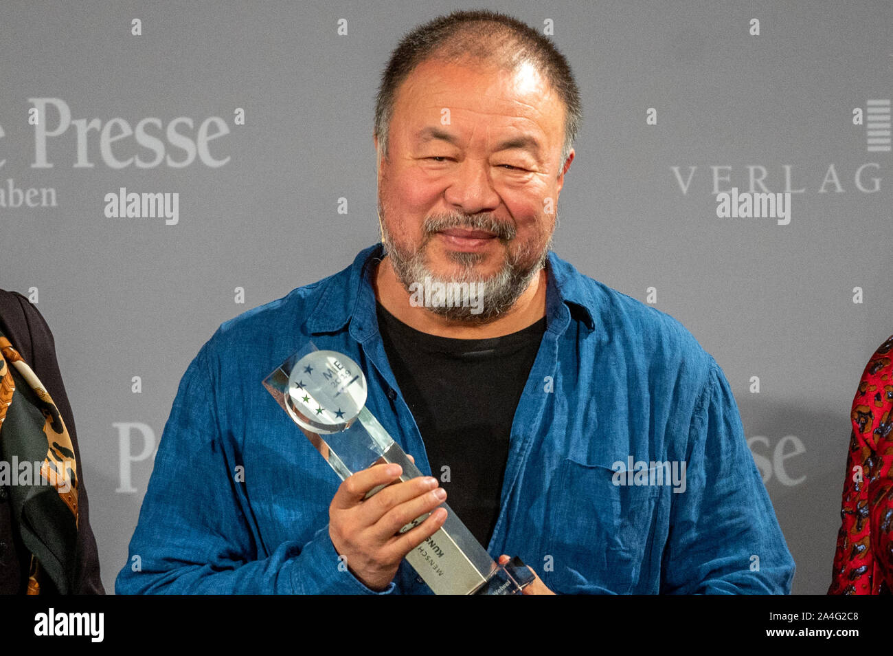 Passau, Germany. 14th Oct, 2019. Ai Weiwei, Chinese artist, presents his "People in Europe Art ...