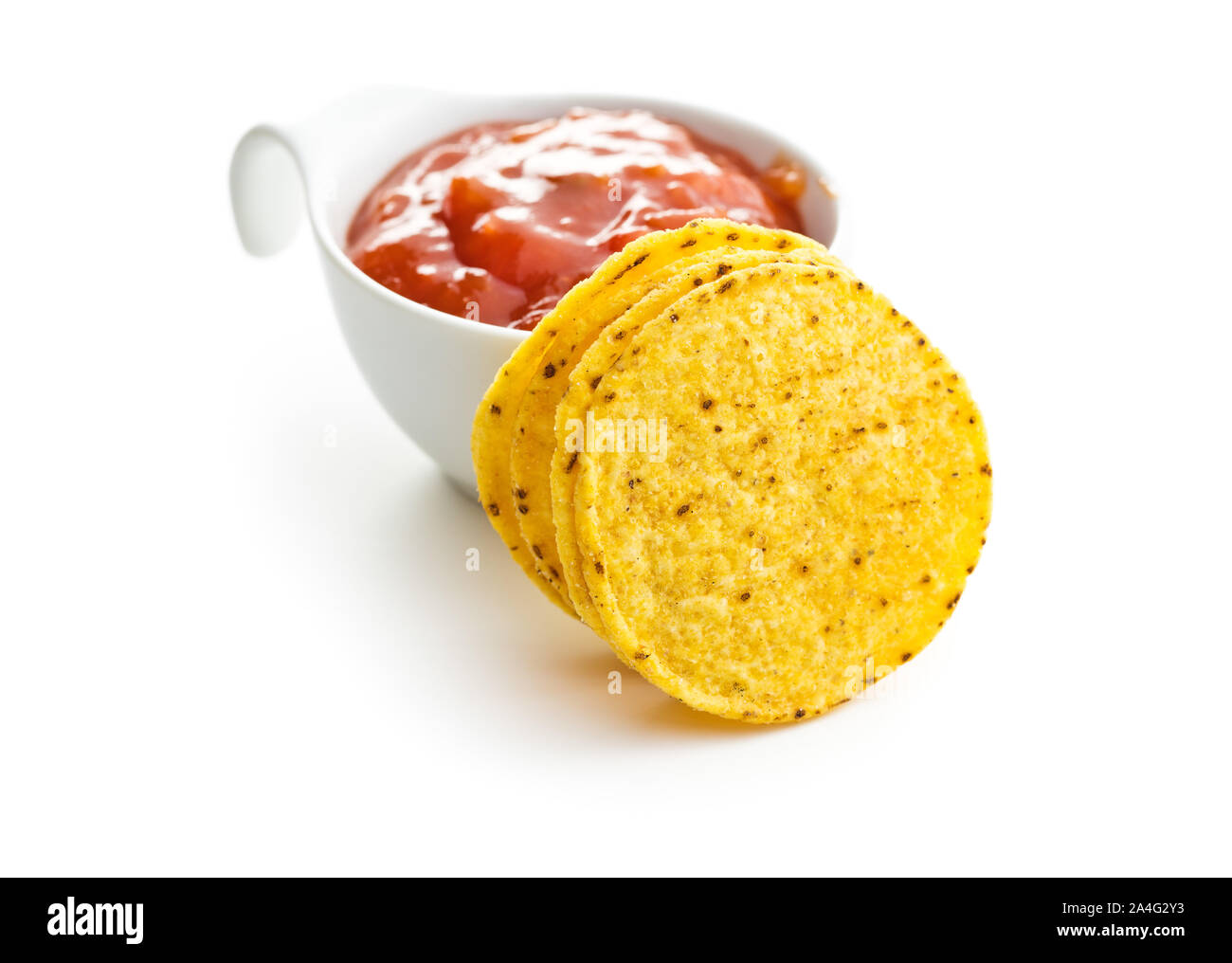 Round corn nacho chips and tomato dip. Yellow tortilla chips and salsa ...
