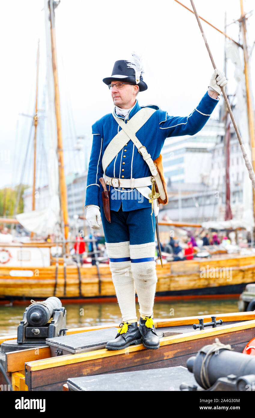 HELSINKI, FINLAND - OCTOBER 12, 2019: Sailor in ancient uniform stand ...