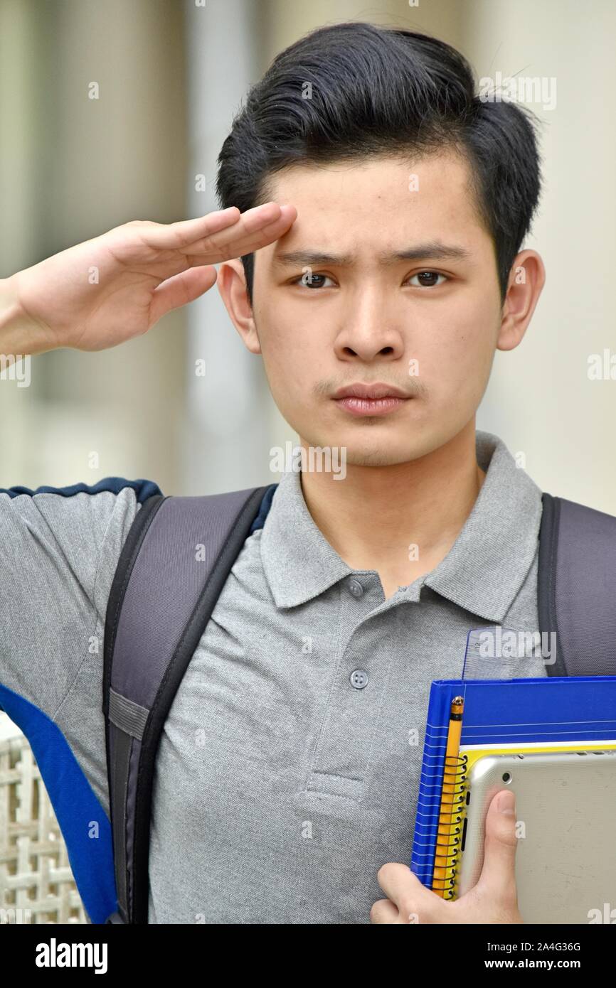 An University Diverse Boy Student Saluting Stock Photo - Alamy