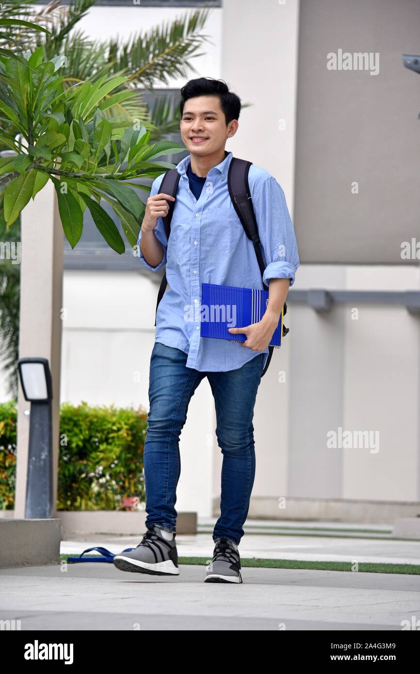 Smart College Diverse Person With Books Walking On Campus Stock Photo ...