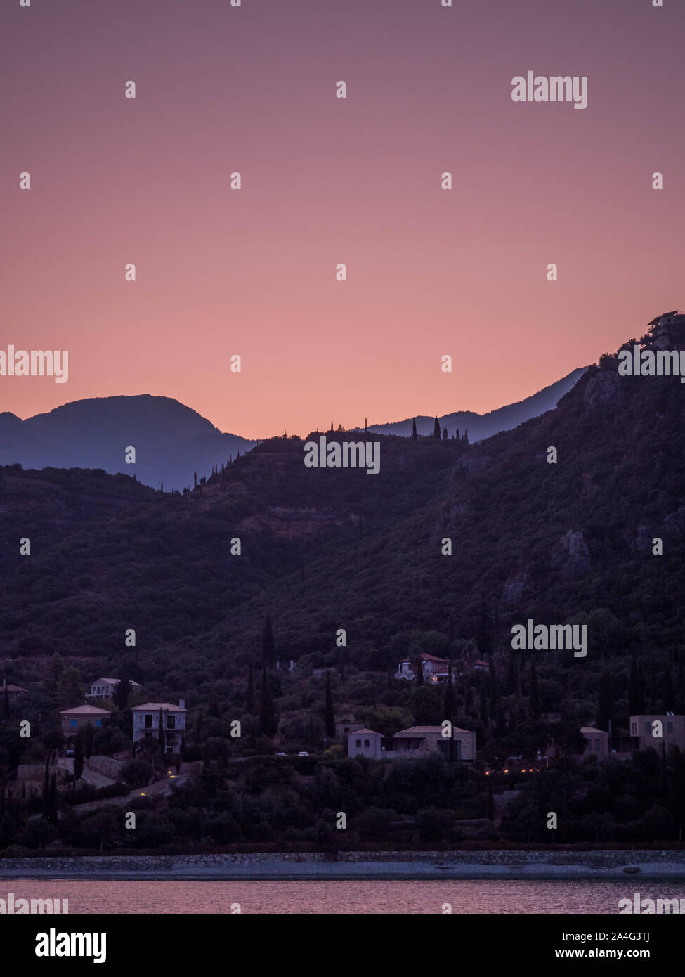 Pink purple sunset over Kardimili Peloponnese Greece with mountain ...
