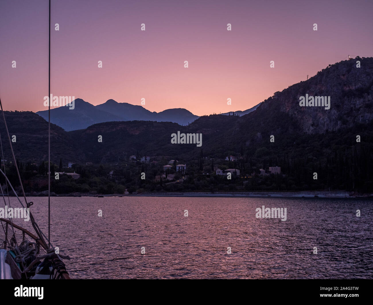 Pink purple sunset over Kardimili Peloponnese Greece with mountain ...