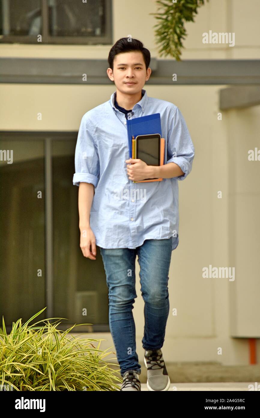 An Intelligent Boy Student Walking Stock Photo - Alamy