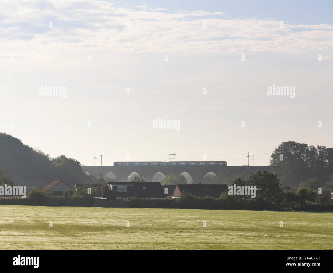 Arriva Northern rail class 319 electric train crossing Sankey Viaduct ...