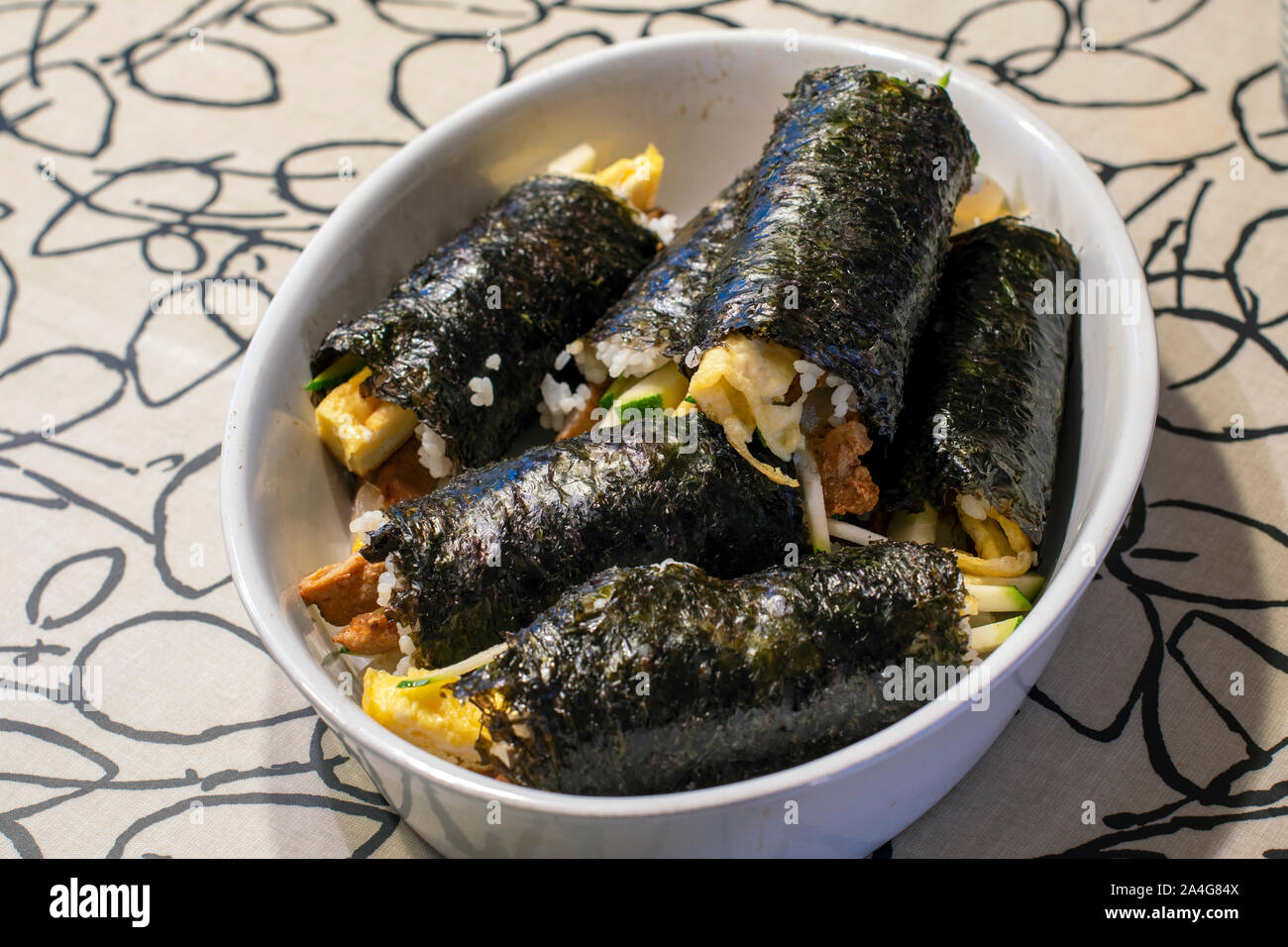 Big kimbap rolls in a bowl Stock Photo - Alamy