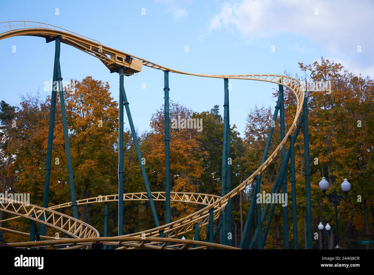 Close up modern Cool roller coaster ride against amusement park and ...