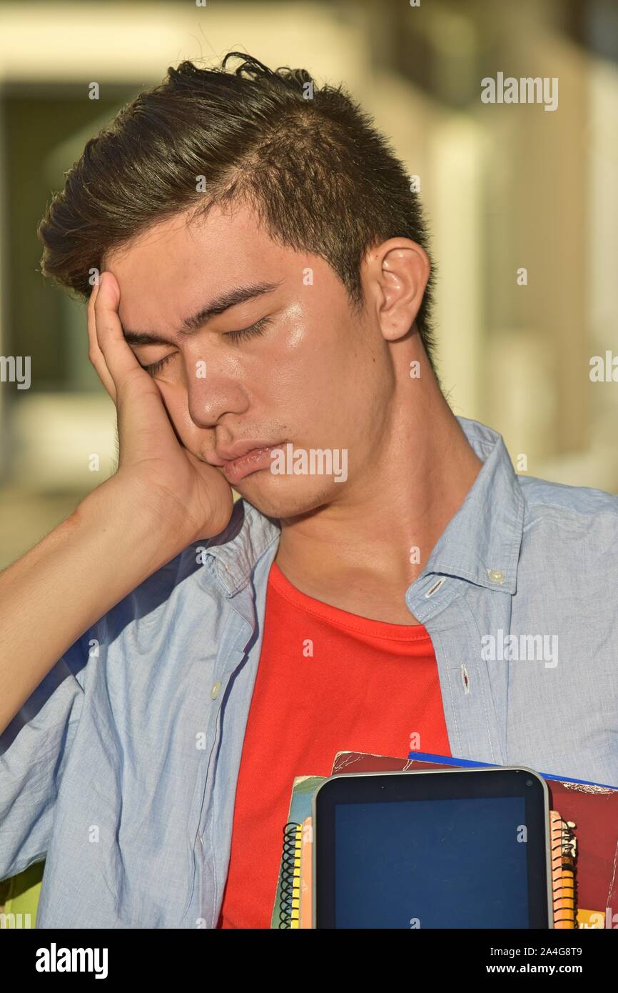 Sad University Person With Books Stock Photo - Alamy