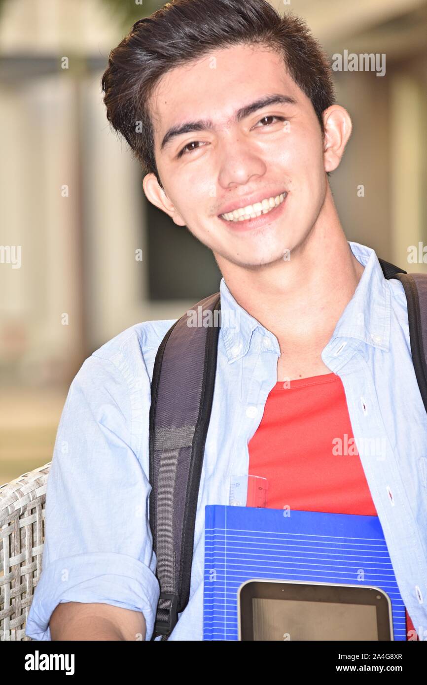 Filipino Boy Student Smiling With Notebooks Stock Photo - Alamy