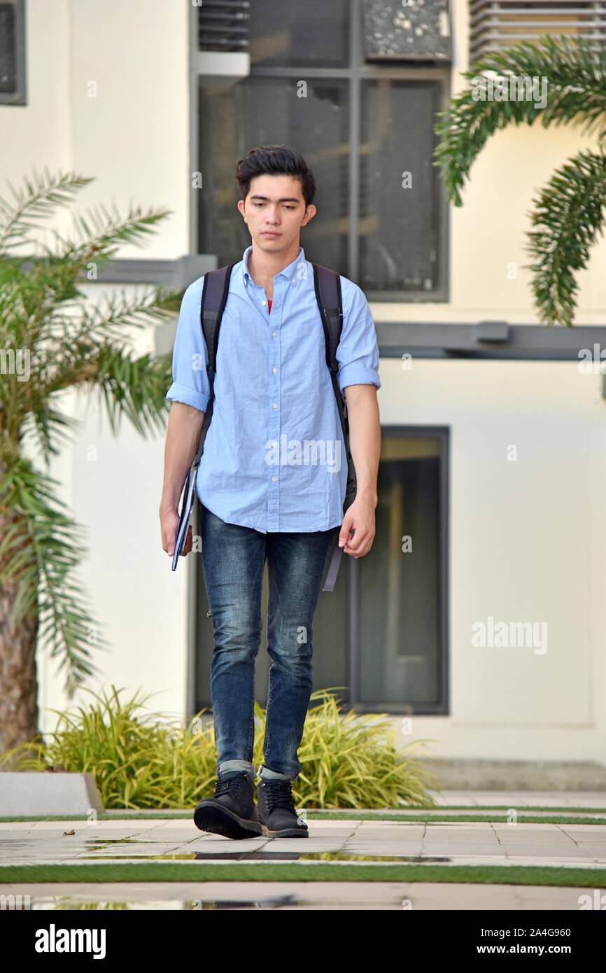 Sad University Filipino Boy Student Walking Stock Photo - Alamy